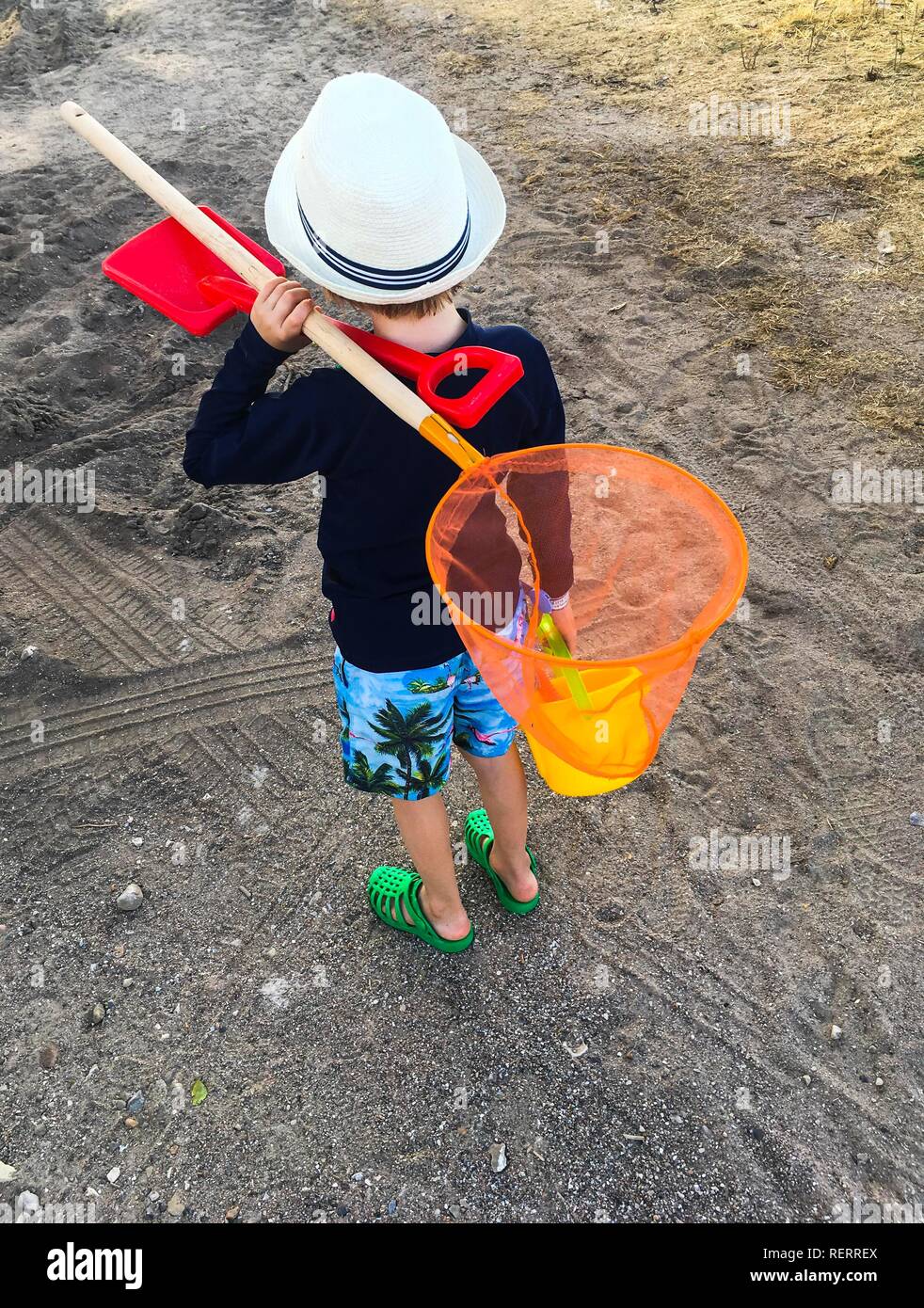 Boy with fishing net hi-res stock photography and images - Alamy