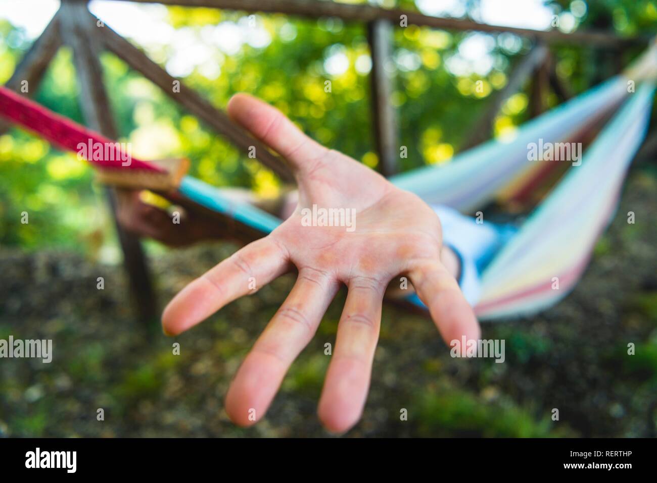Stretches hand hi-res stock photography and images - Alamy