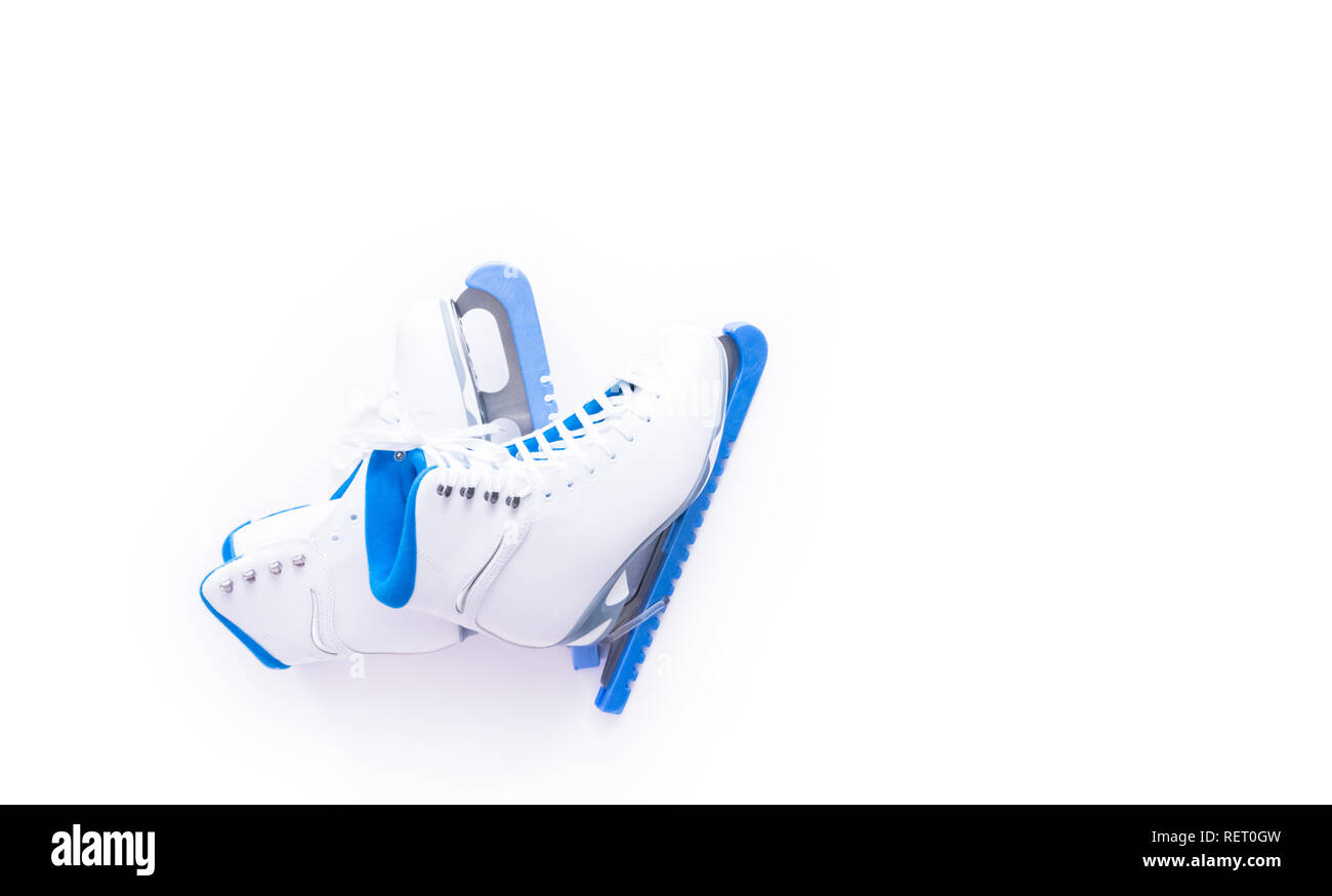 Flat lay. New white figure skates on a white background Stock Photo - Alamy