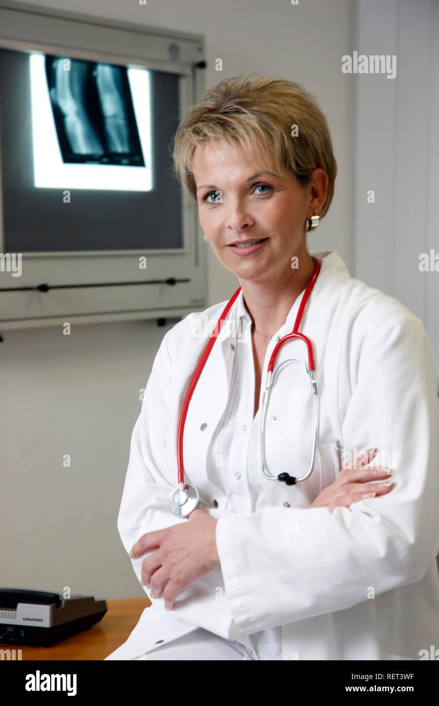 Female doctor in her doctor's office in a hospital Stock Photo - Alamy