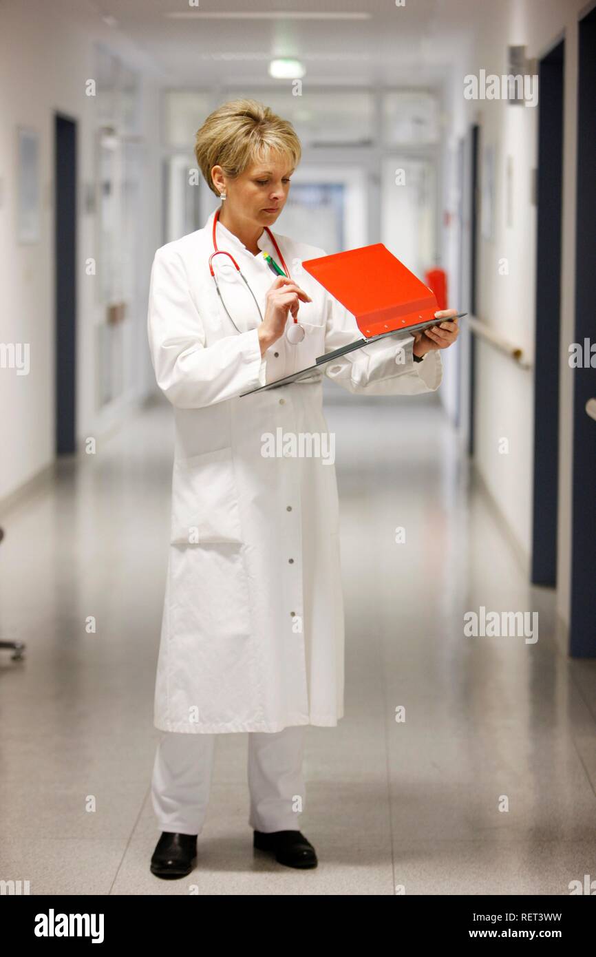 Female doctor in a hospital ward corridor Stock Photo - Alamy
