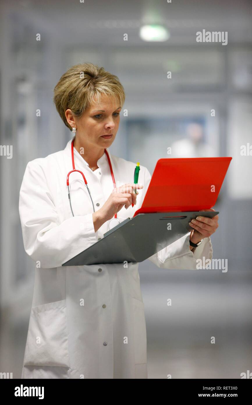 Female doctor in a hospital ward corridor Stock Photo - Alamy