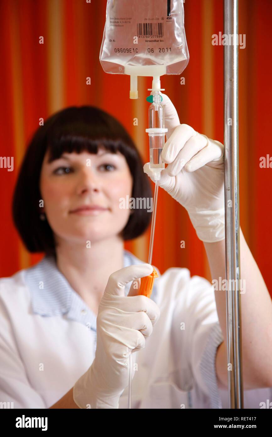 Nurse works patient in infusion hi-res stock photography and images - Alamy