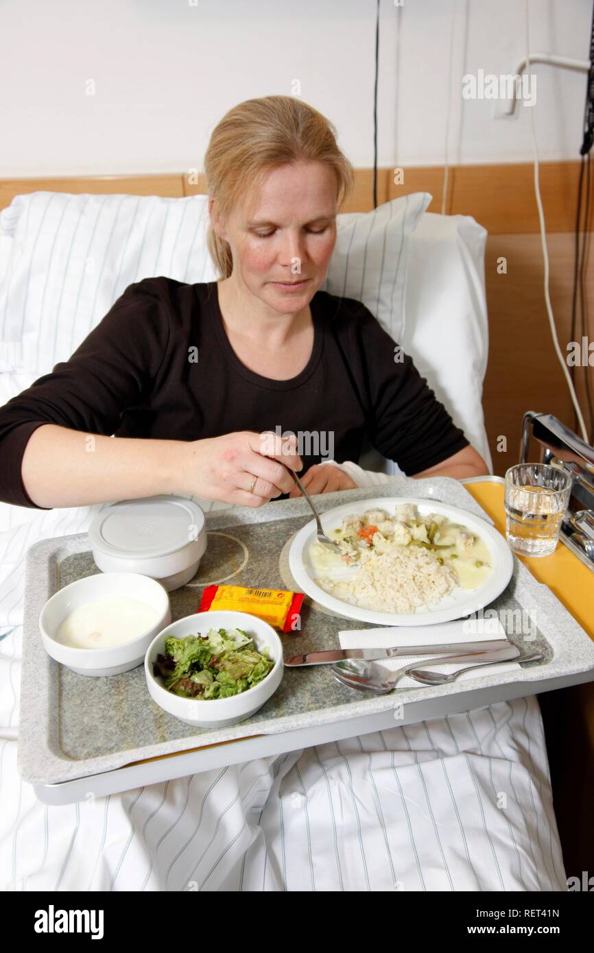 Patient having lunch in a hospital bed Stock Photo - Alamy
