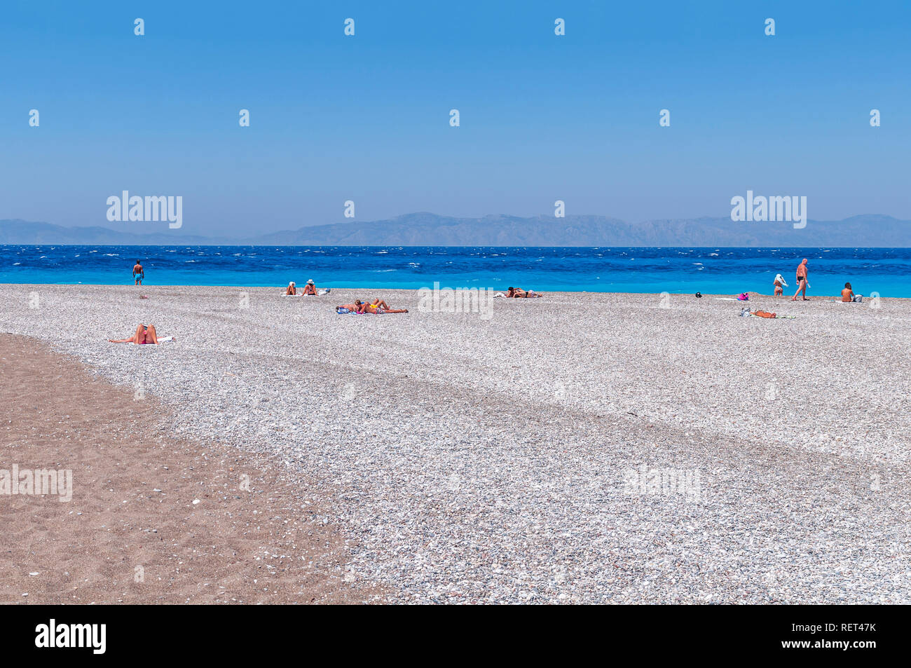 RHODES, GREECE - September 5: People on the bech lie and sunbathe on ...