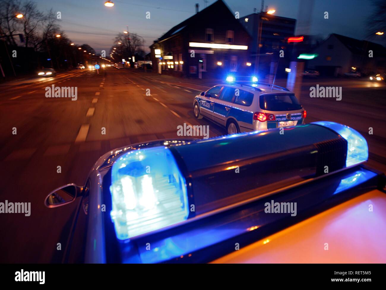 German police cars, blue design, in action with flashing sirens Stock ...
