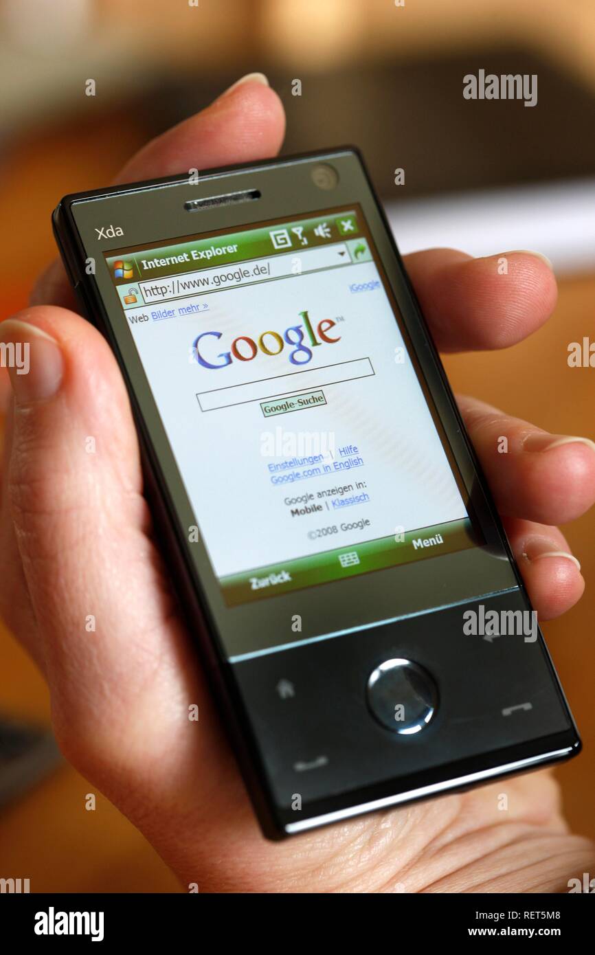 Surfing on the internet with a mobile Stock Photo - Alamy