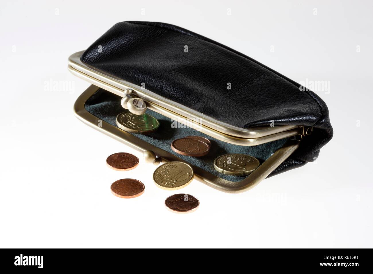 Coins in a purse Stock Photo - Alamy