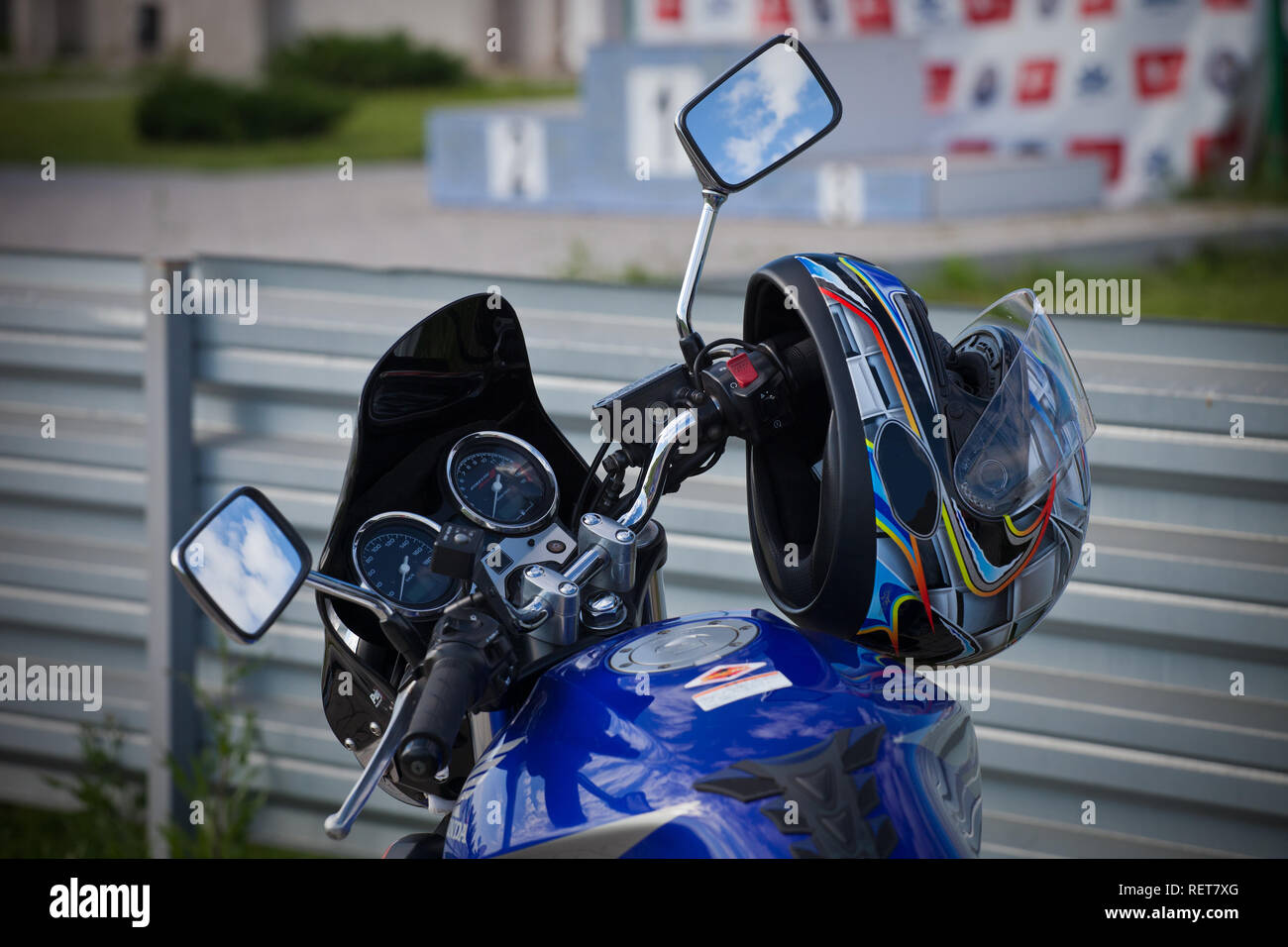 Motorcycle helmet hanging on the handlebars. Motorcycle sport. FIM Road ...