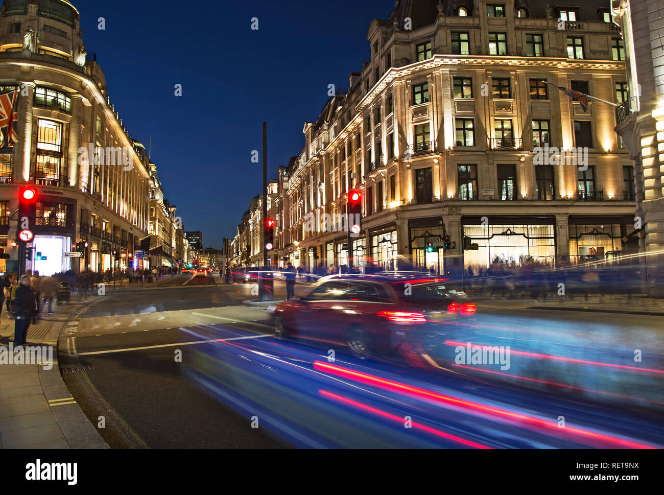 night scene of London city with moving cars and bus - long exposure ...