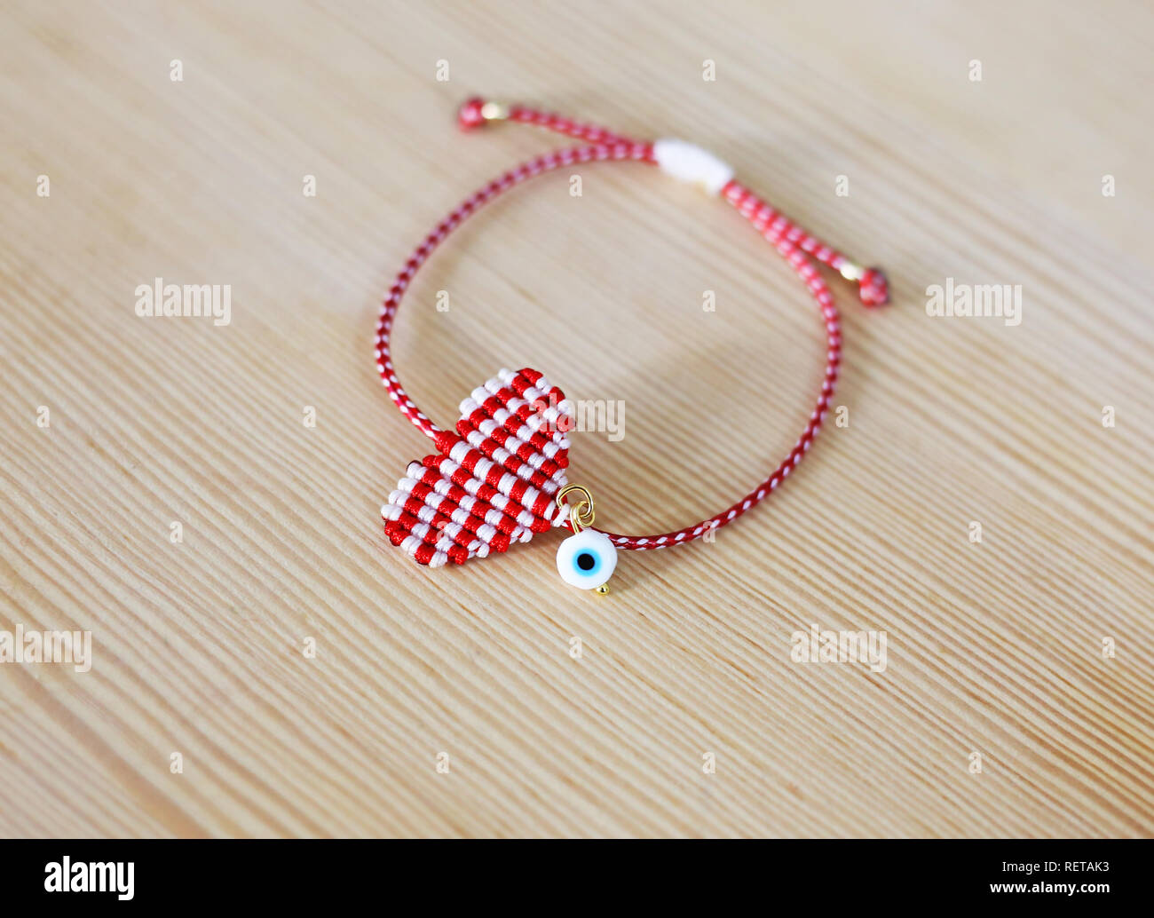 the traditional greek March bracelet called Martaki in red and white ...