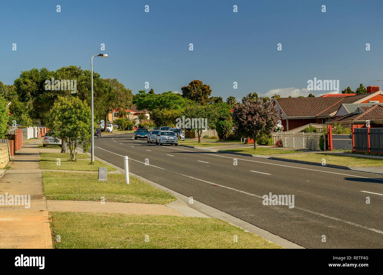 Sunny summer day in Hallam, Australia. Beautiful houses and well-kept ...