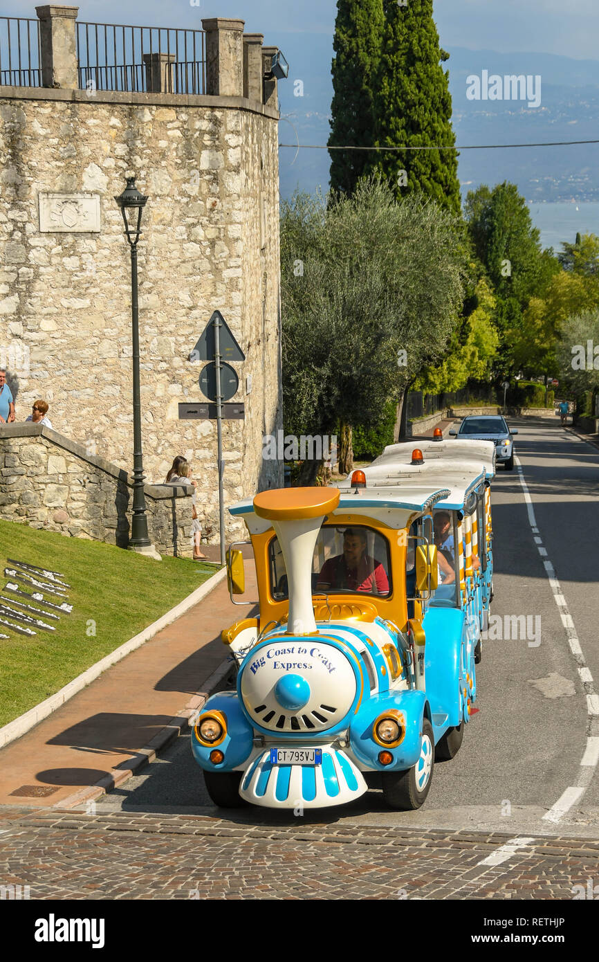 GARDONE RIVIERA, ITALY - SEPTEMBER 2018: Small tourist land train in ...