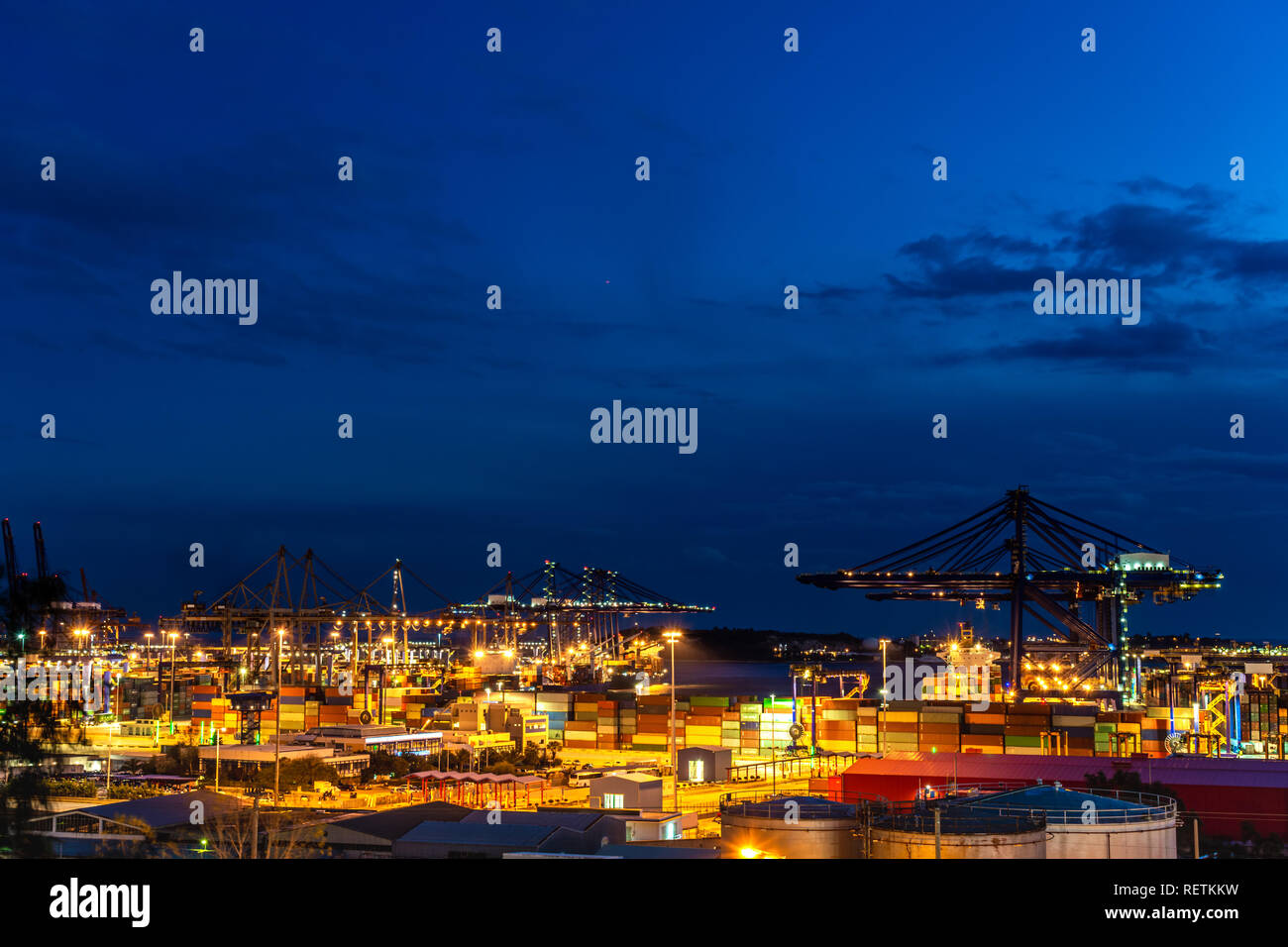 Container Cargo freight ship with working crane bridge in shipyard at ...