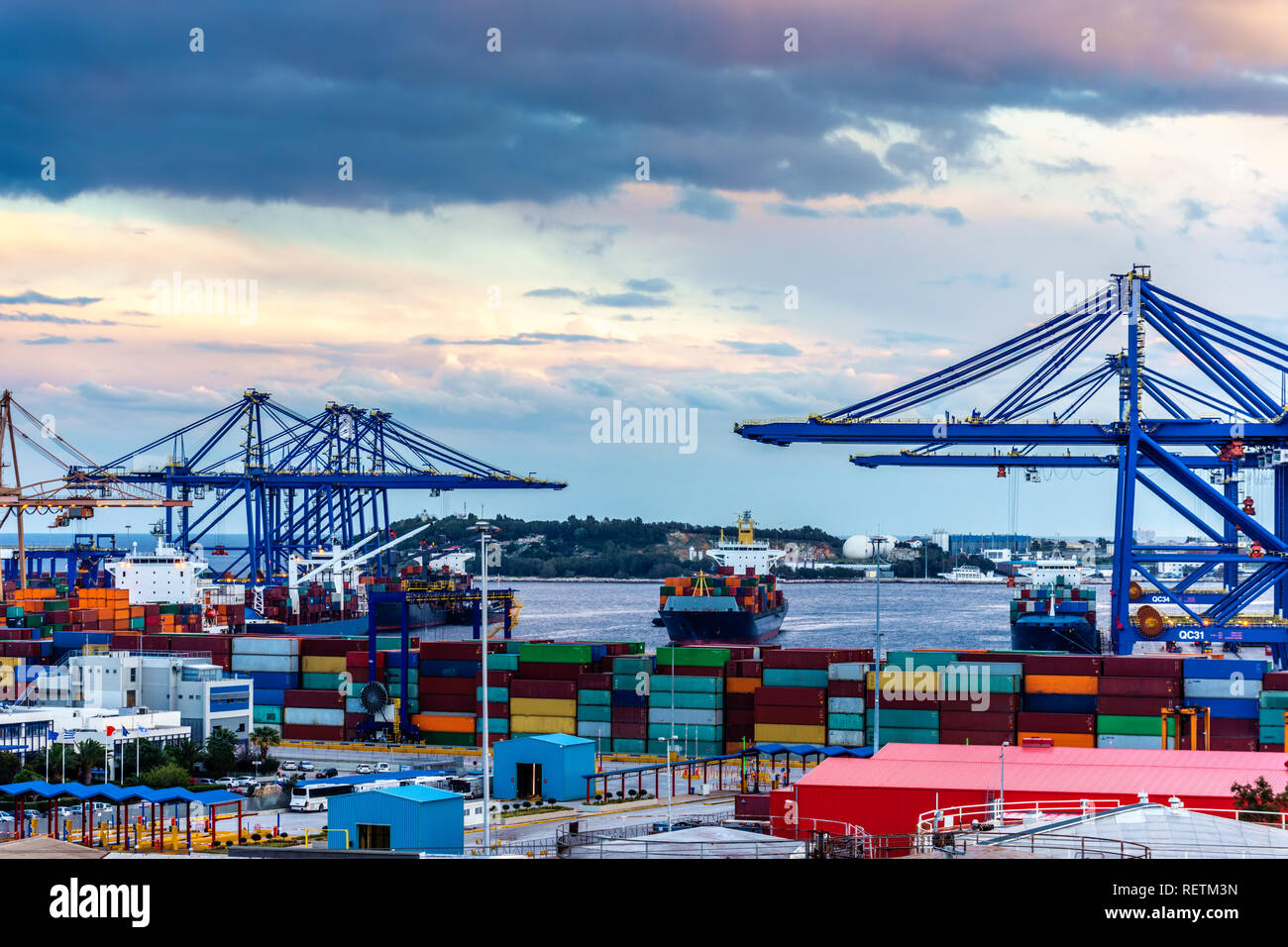 Container Cargo freight ship with working crane bridge in shipyard at ...