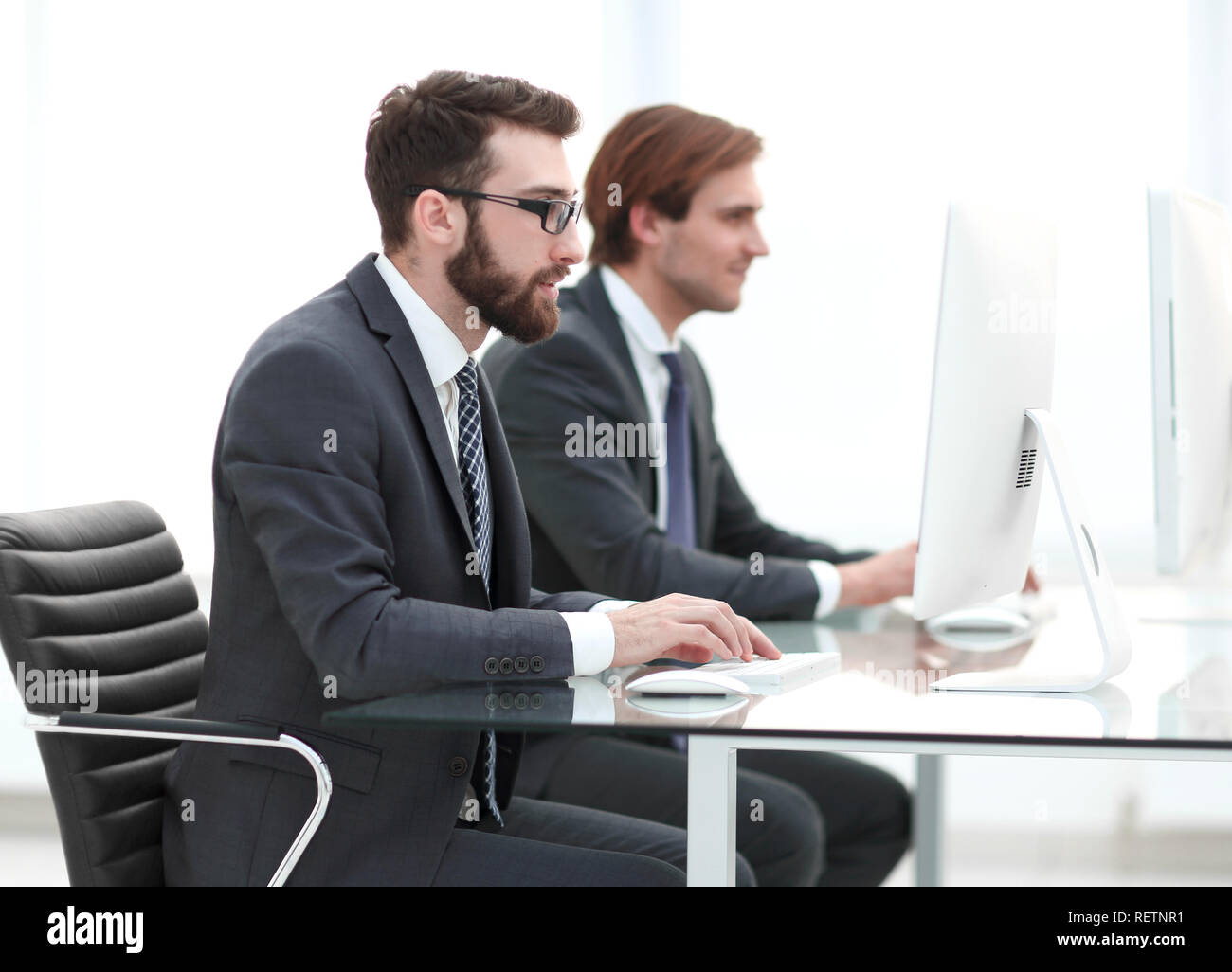 Company employees working in software development Stock Photo - Alamy