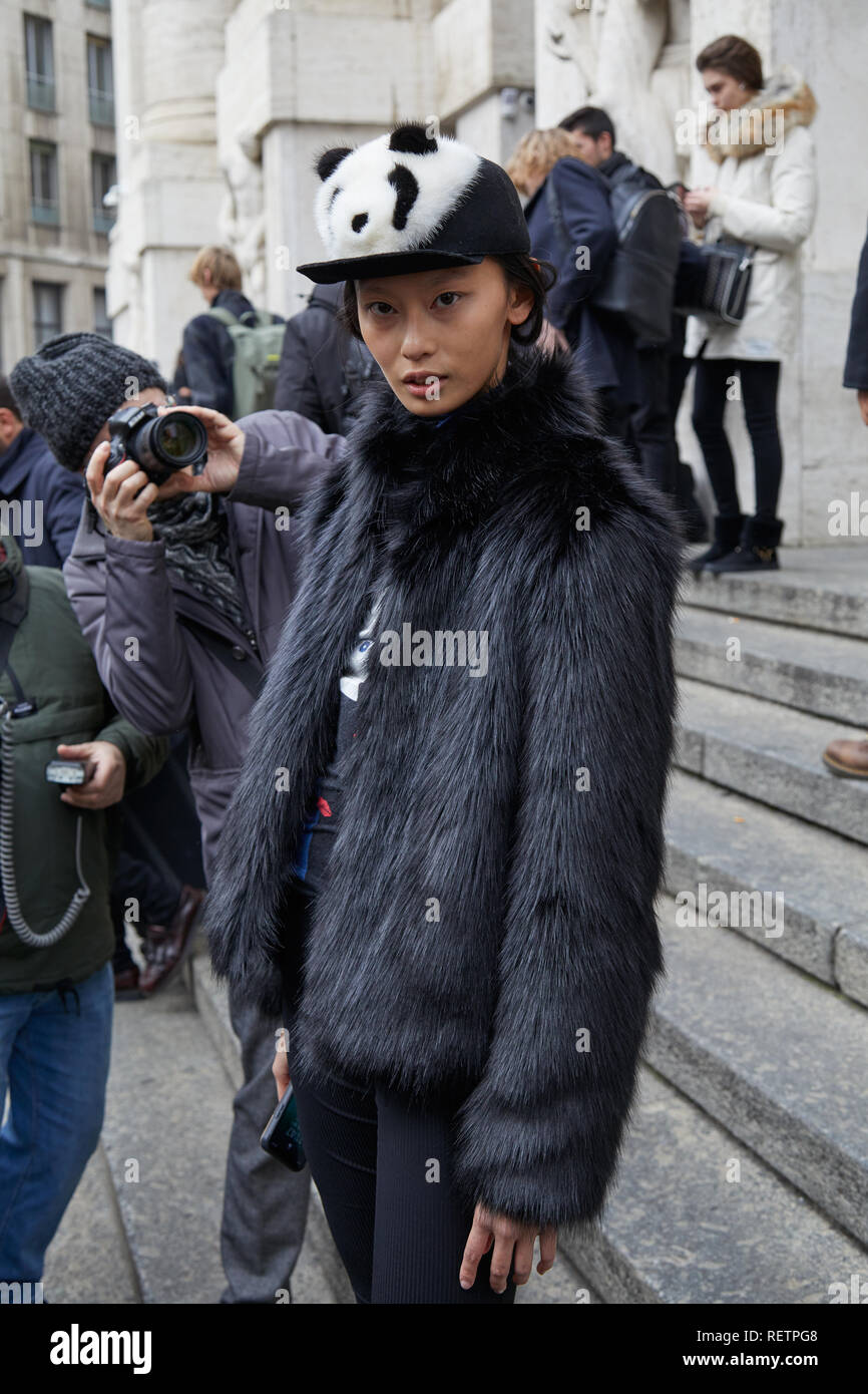 MILAN, ITALY - JANUARY 12, 2019: Top model with black fur coat and ...