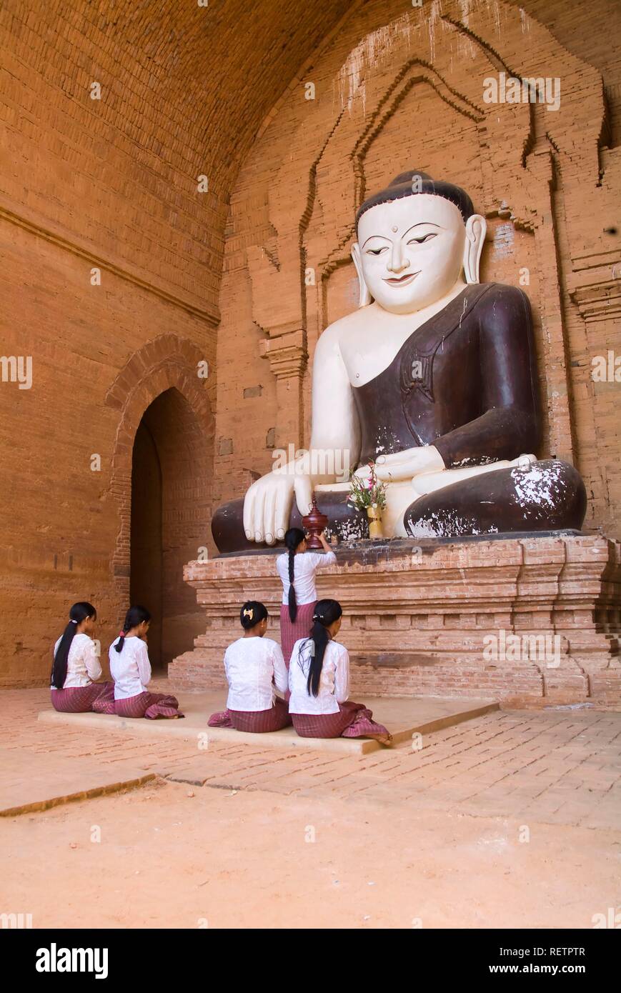 Burmese women praying to Buddha, Bagan, Myanmar Stock Photo - Alamy