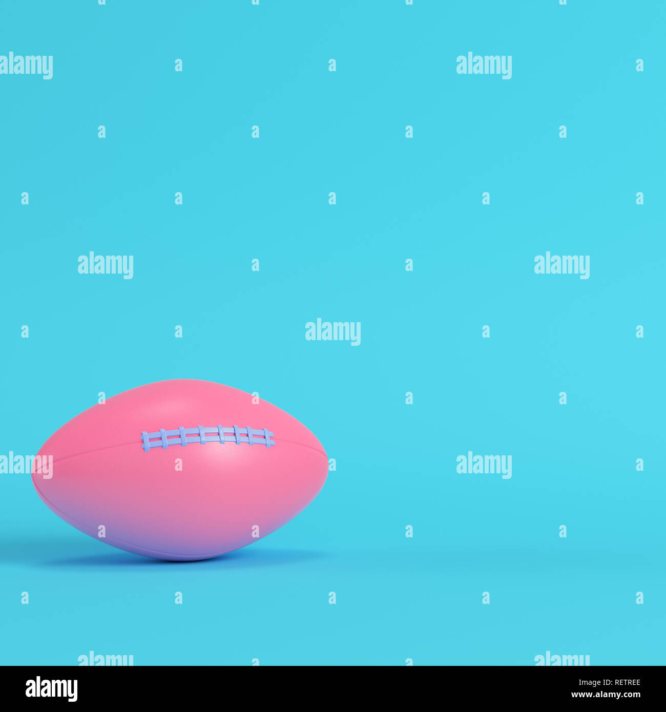Pink american football ball on bright blue background in pastel colors ...