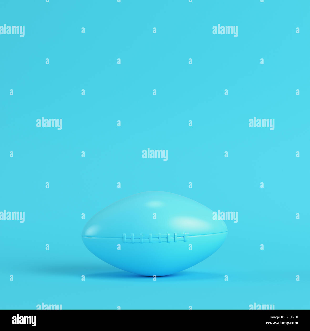 American football ball on bright blue background in pastel colors ...