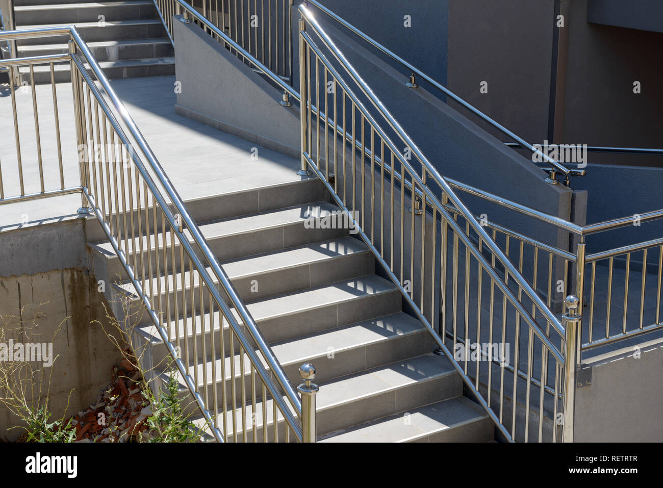 Abstract fragment of stairwell of modern design with many steel ...
