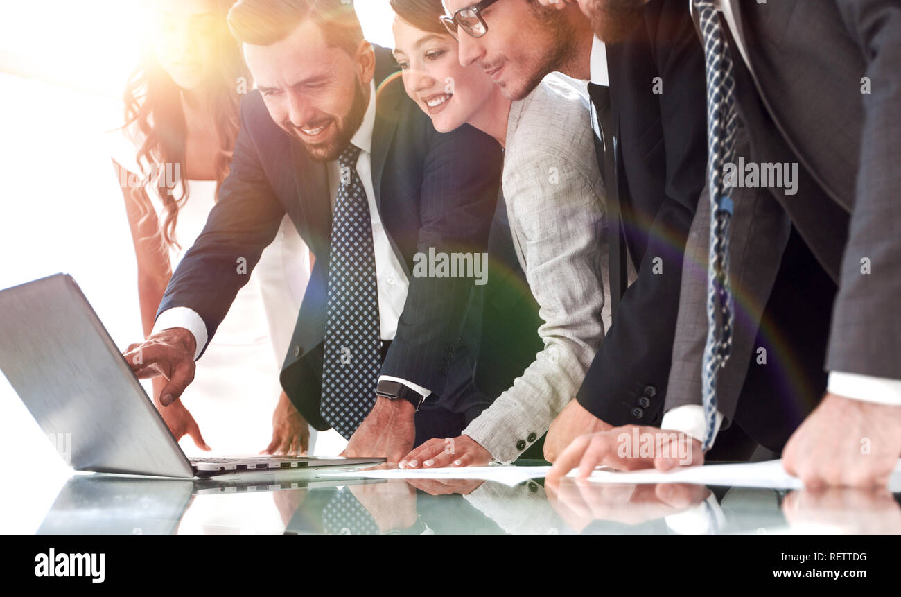 business team looking at the laptop screen Stock Photo - Alamy