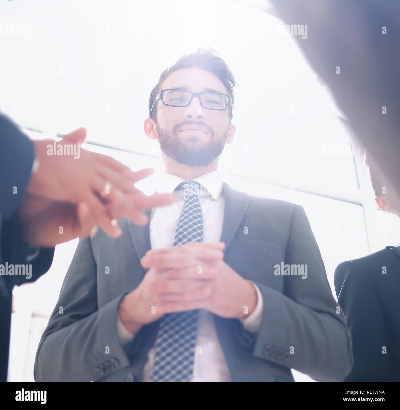 bottom view.group of business people standing in the office Stock Photo ...