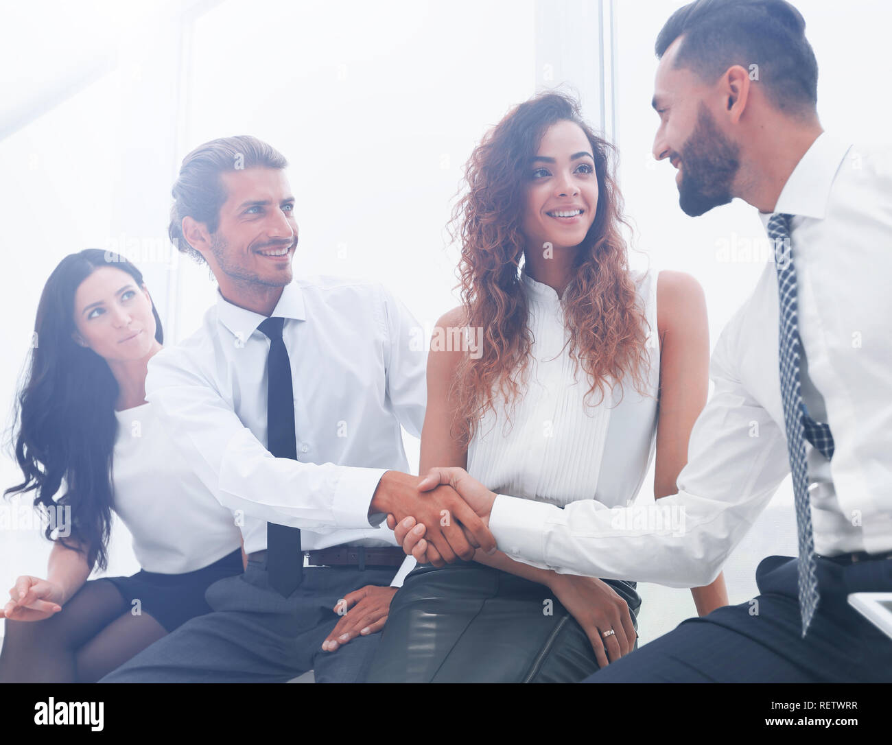 welcome handshake between two colleagues Stock Photo - Alamy