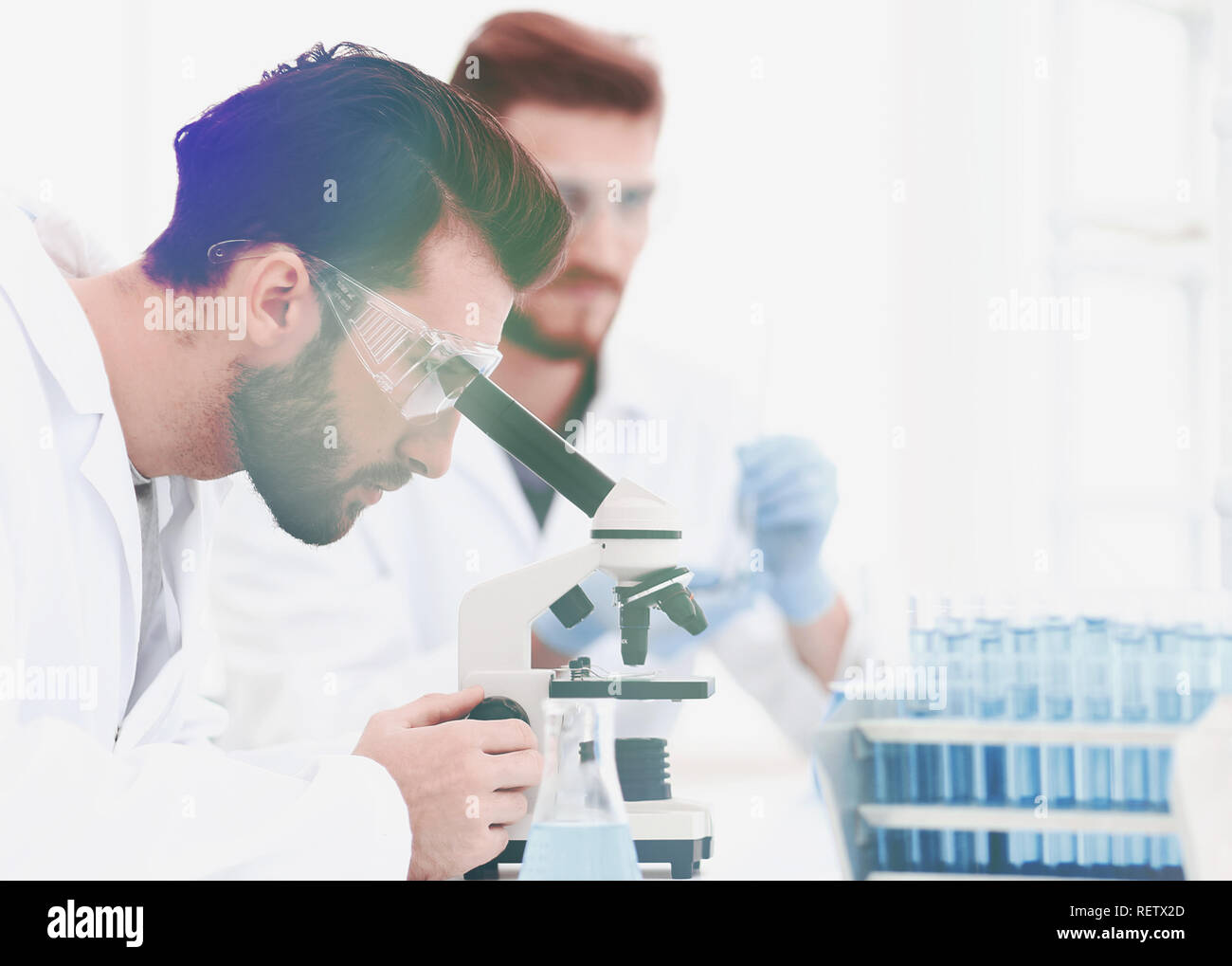 biologist explores the substance under the microscope Stock Photo - Alamy