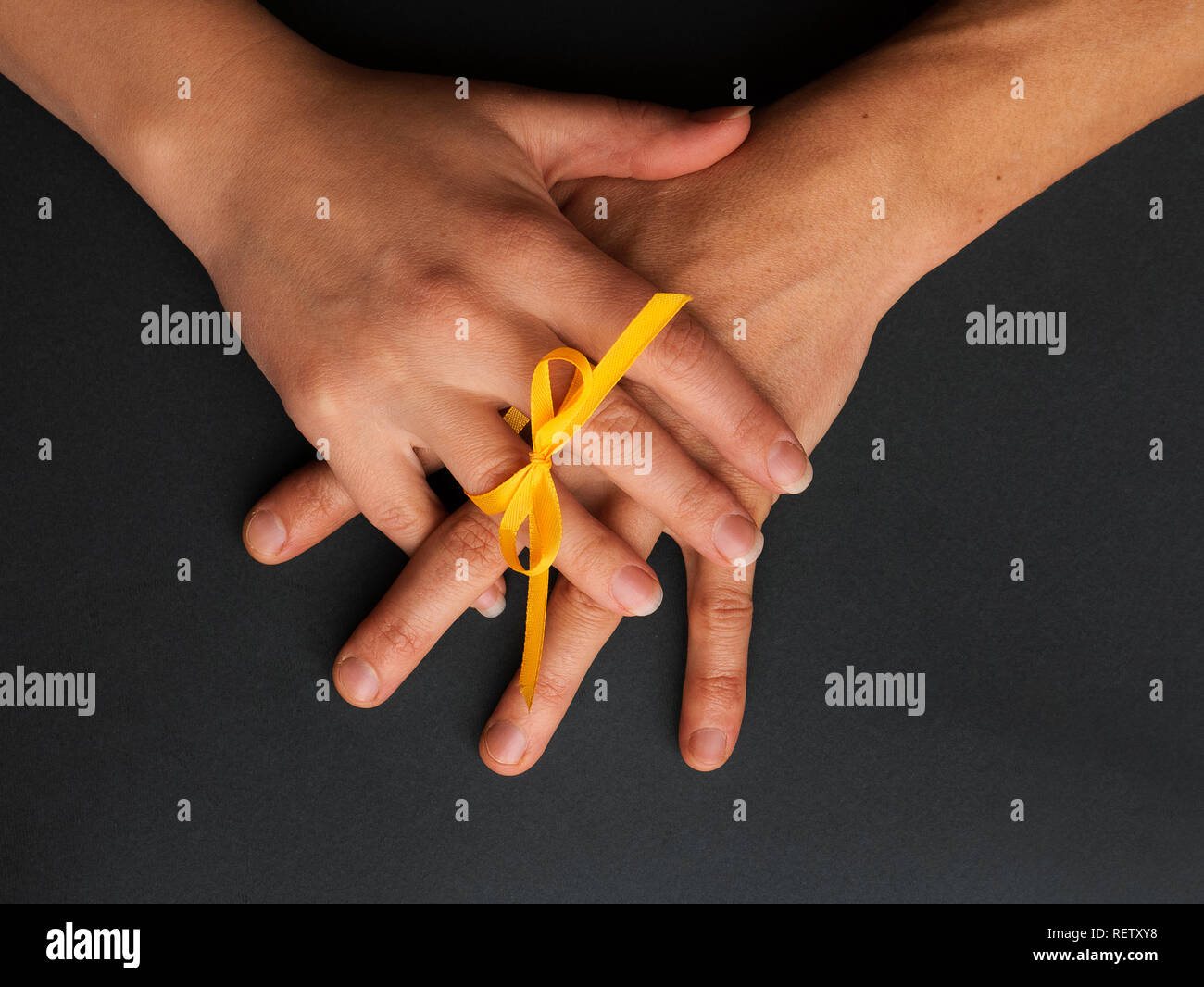 Hand finger with a ribbon hi-res stock photography and images - Alamy