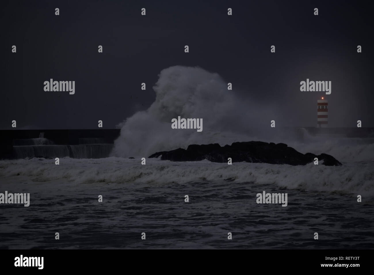 Dark night storm in the sea beacon and pier Stock Photo - Alamy