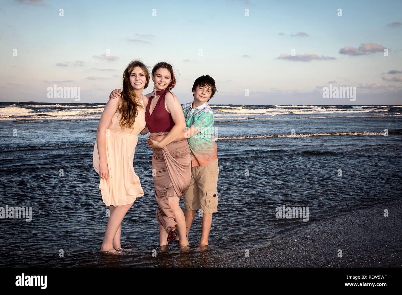 Kids on Beach at sunset Stock Photo - Alamy