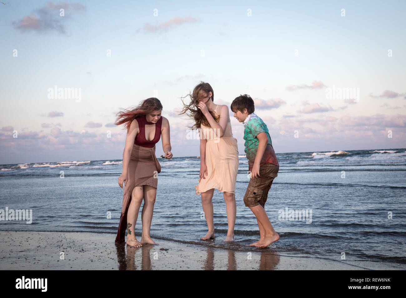 Kids on Beach at sunset Stock Photo - Alamy