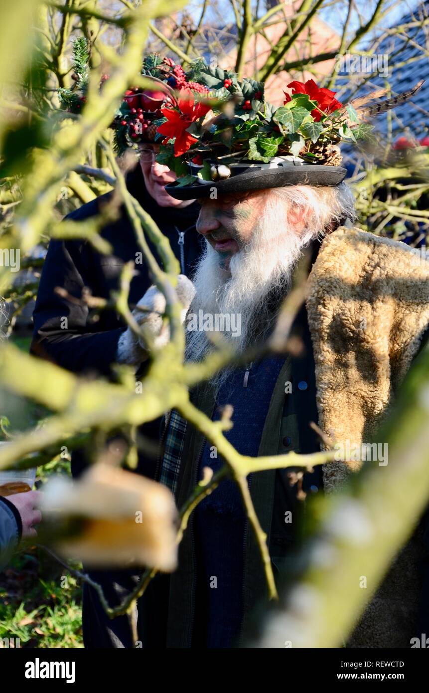 Man with grey hair & beard wearing decorated hat at the Wassail ...