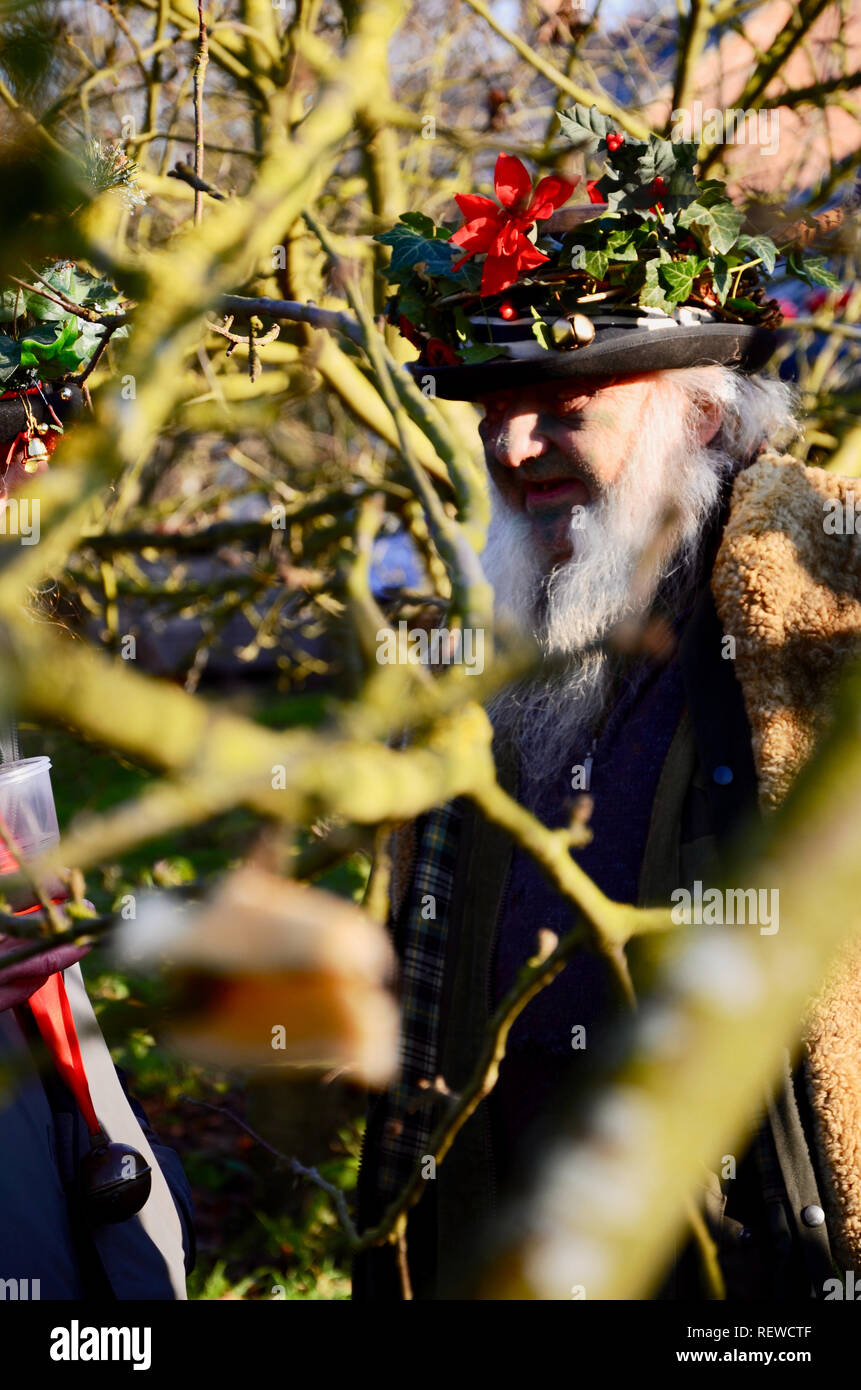 Man with grey hair & beard wearing decorated hat at the Wassail ...