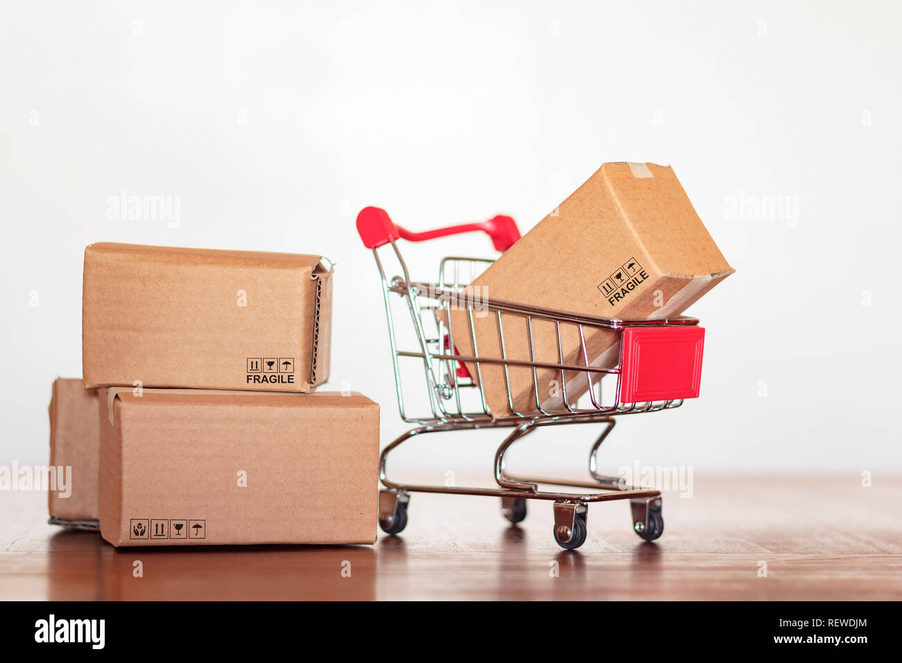 Shopping with cartons Stock Photo - Alamy