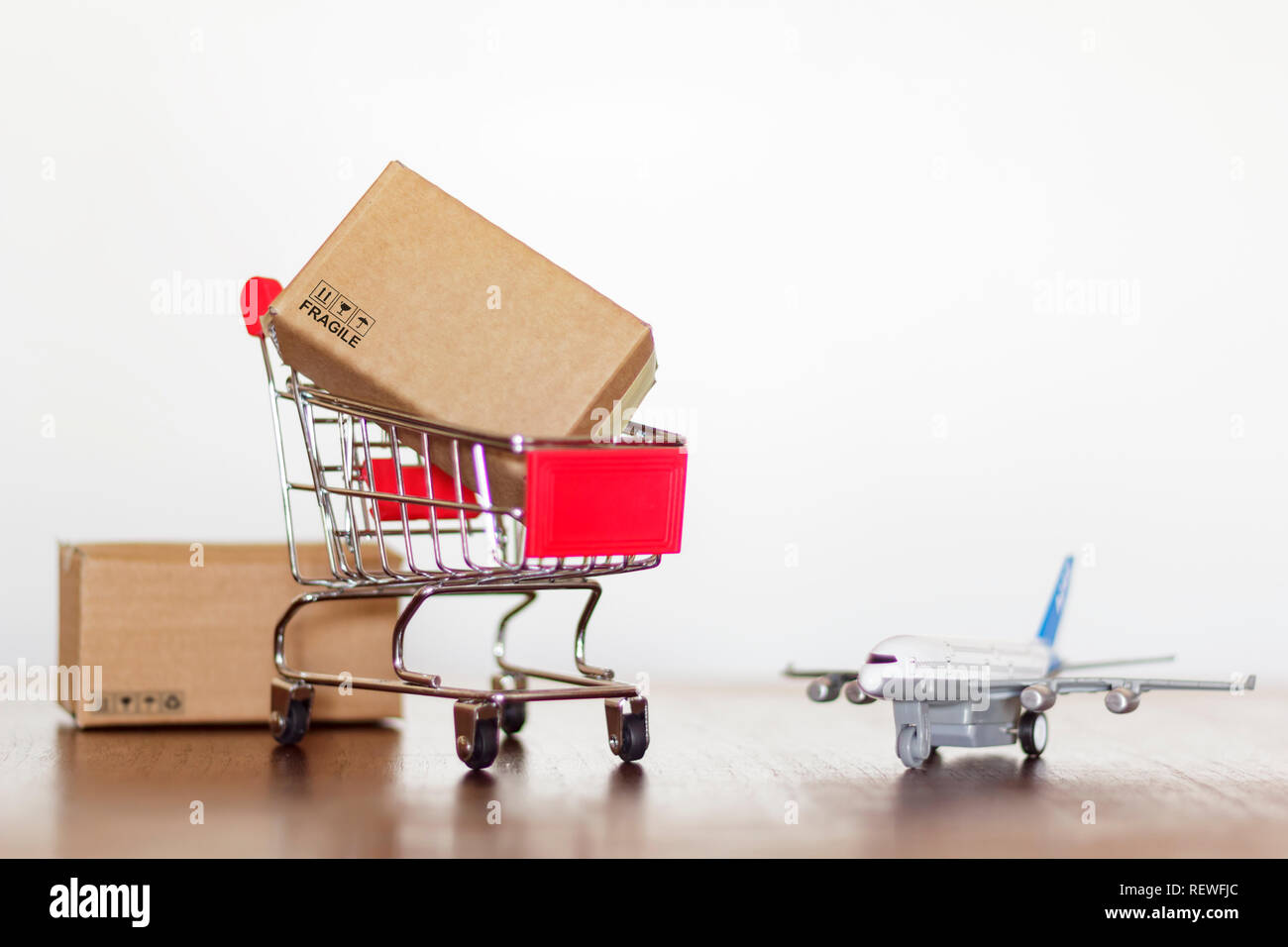 Shopping cart with boxes and airplane. Worldwide Shopping and shipping ...