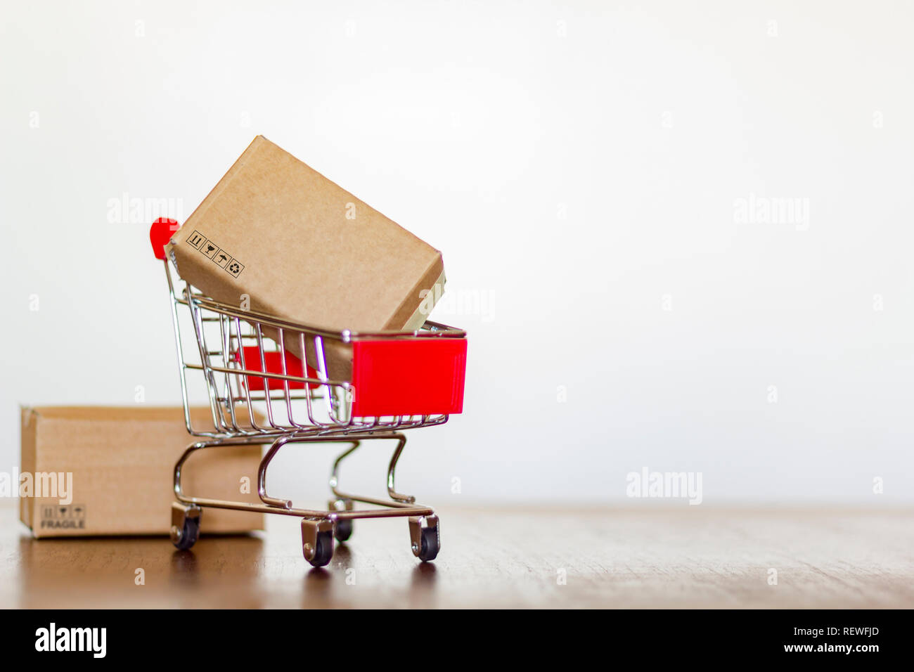 Shopping trolley with delivery boxes Stock Photo - Alamy