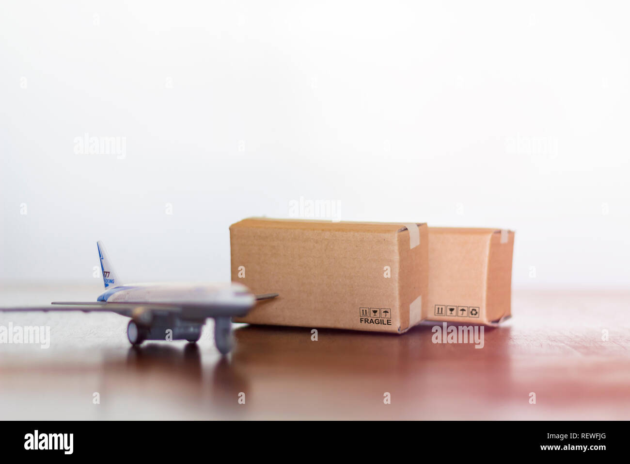 Carton and airplane. International delivery and global logistics ...