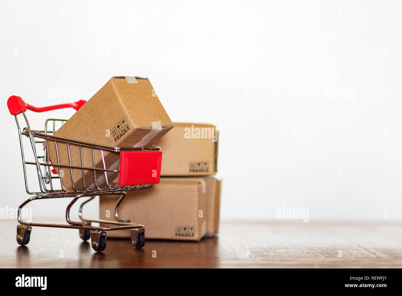 Trolley with cartons. With copy space Stock Photo - Alamy