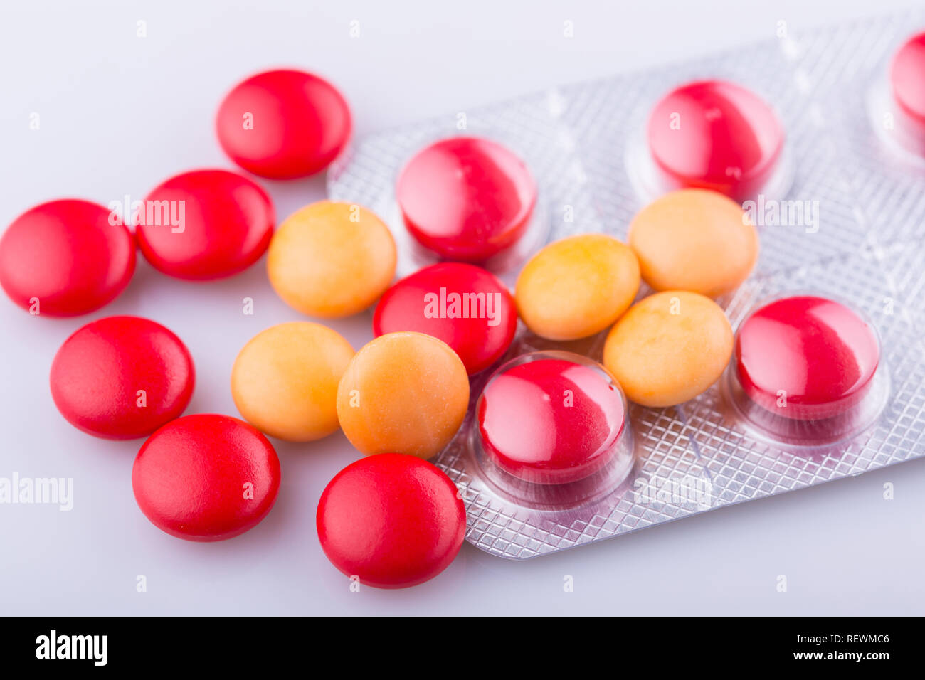 Tablets pills capsule heap mix therapy drugs, over a white background ...