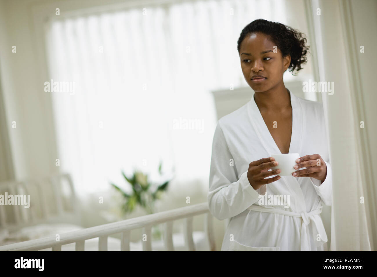 Woman wearing white bath robe hi-res stock photography and images - Alamy