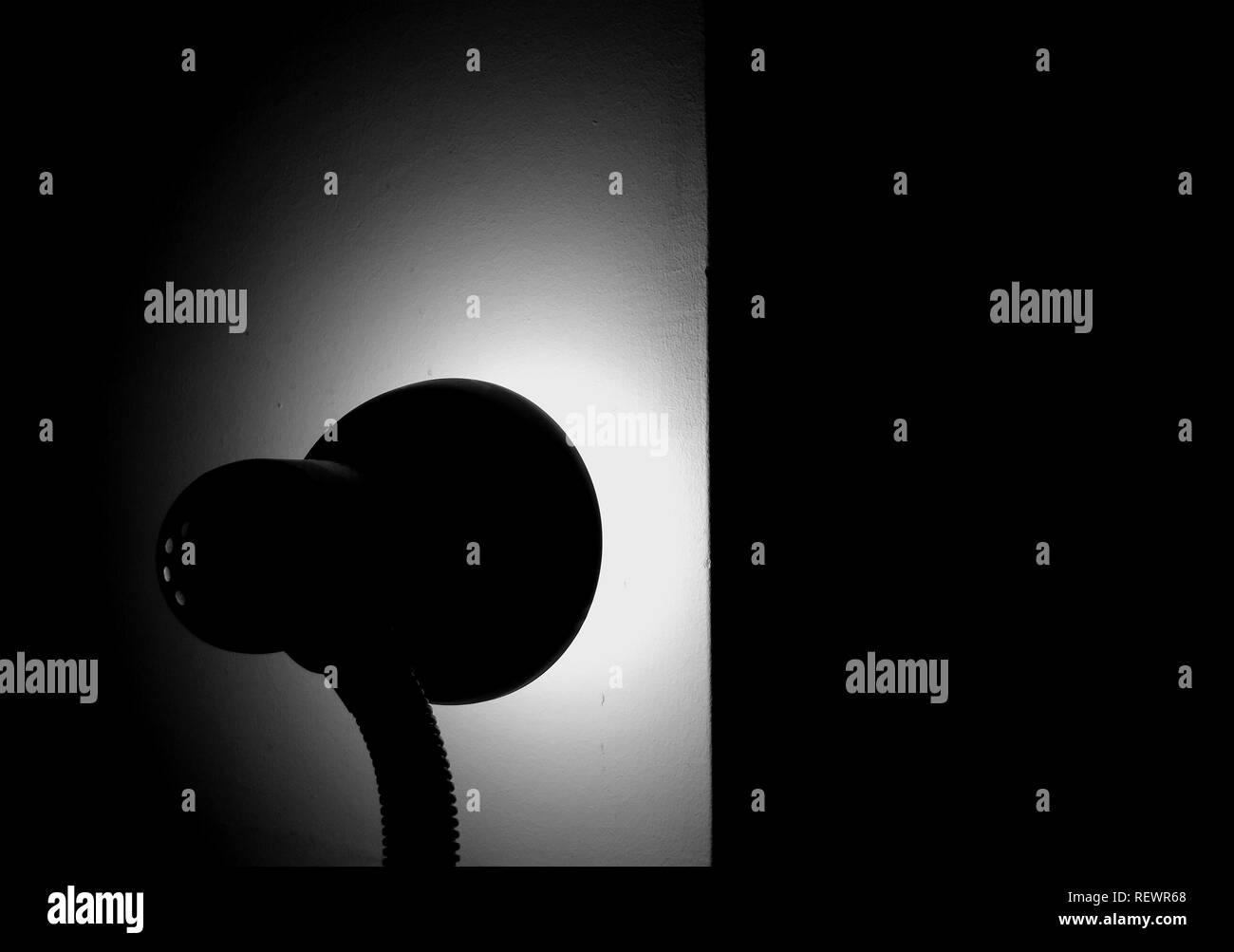 Table lamp casting light on wall. Concept : Minimalism Stock Photo - Alamy