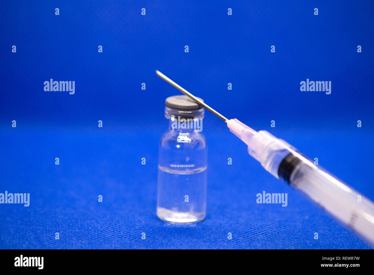 Medicine and drug concept. Medical ampoules, syringe and injection on ...