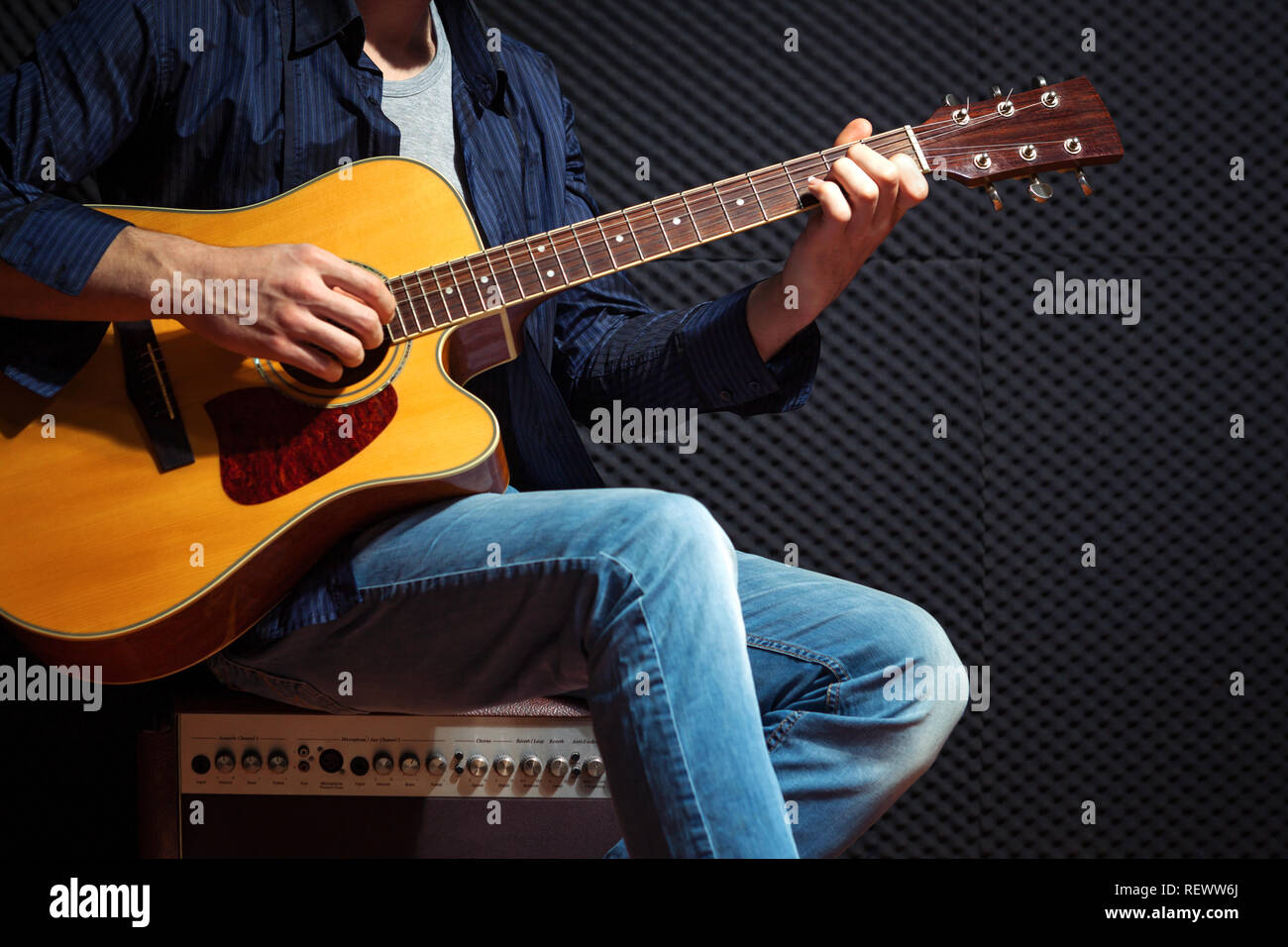 Rock guitarist practicing in sound studio Stock Photo - Alamy