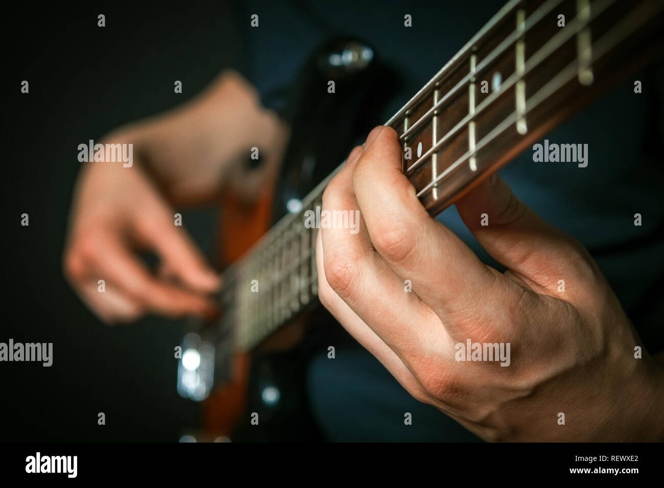 Person playing bass guitar hi-res stock photography and images - Alamy