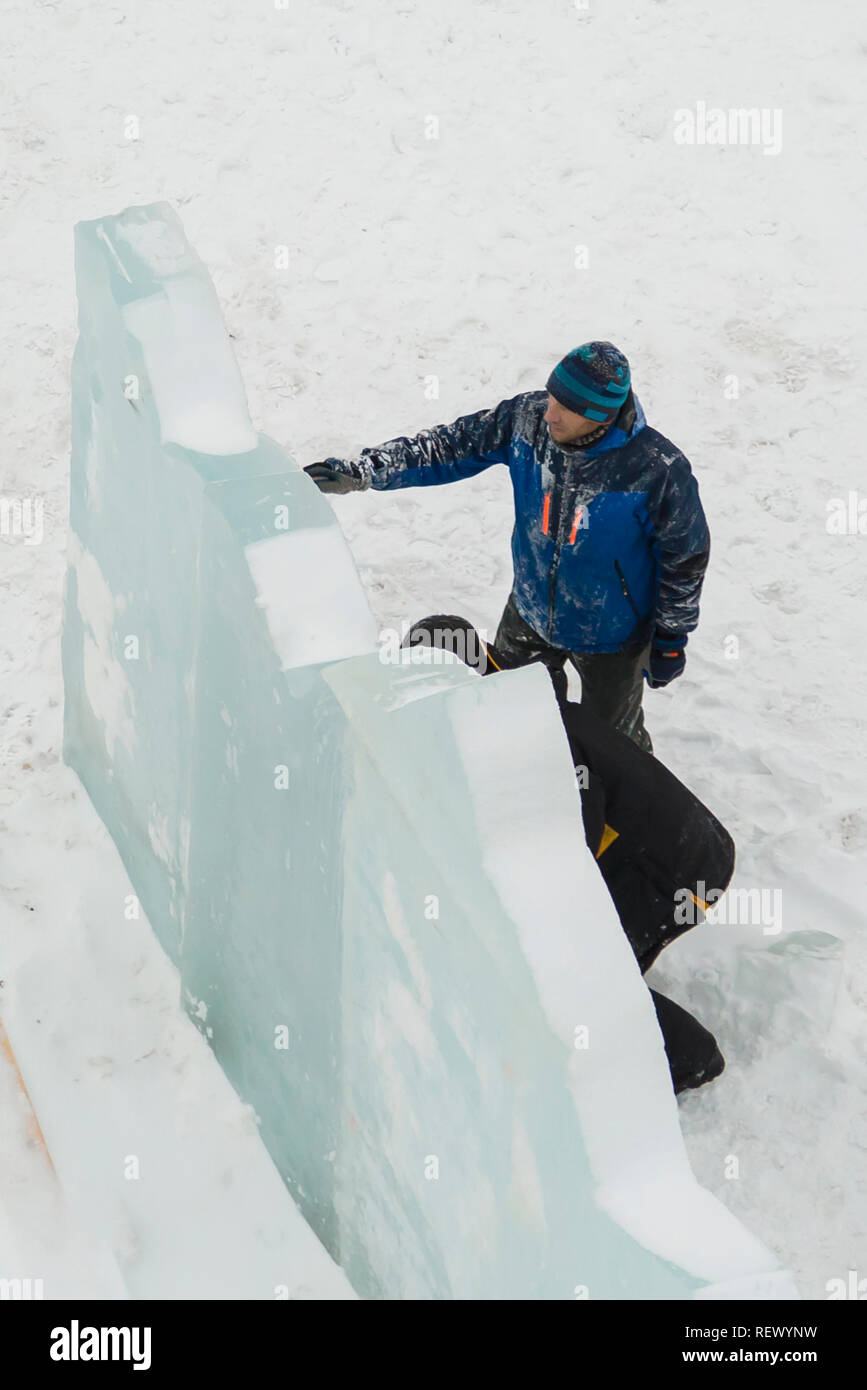 Workers build an ice town for the Christmas holidays Stock Photo - Alamy