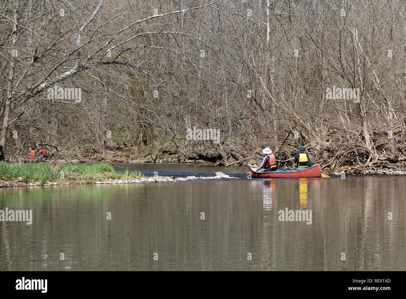 People enjoying a day out canoeing down a river Stock Photo - Alamy