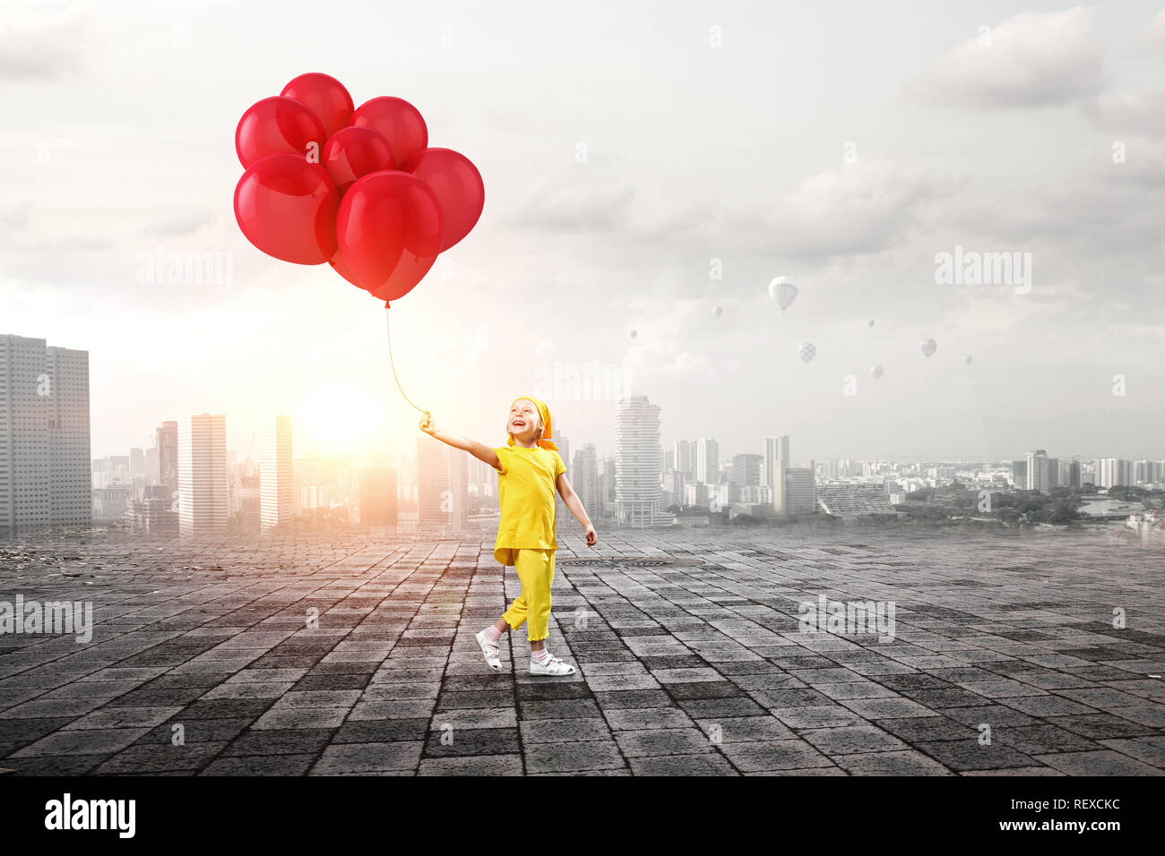 Little kid girl with balloons walking alone. Mixed media Stock Photo ...