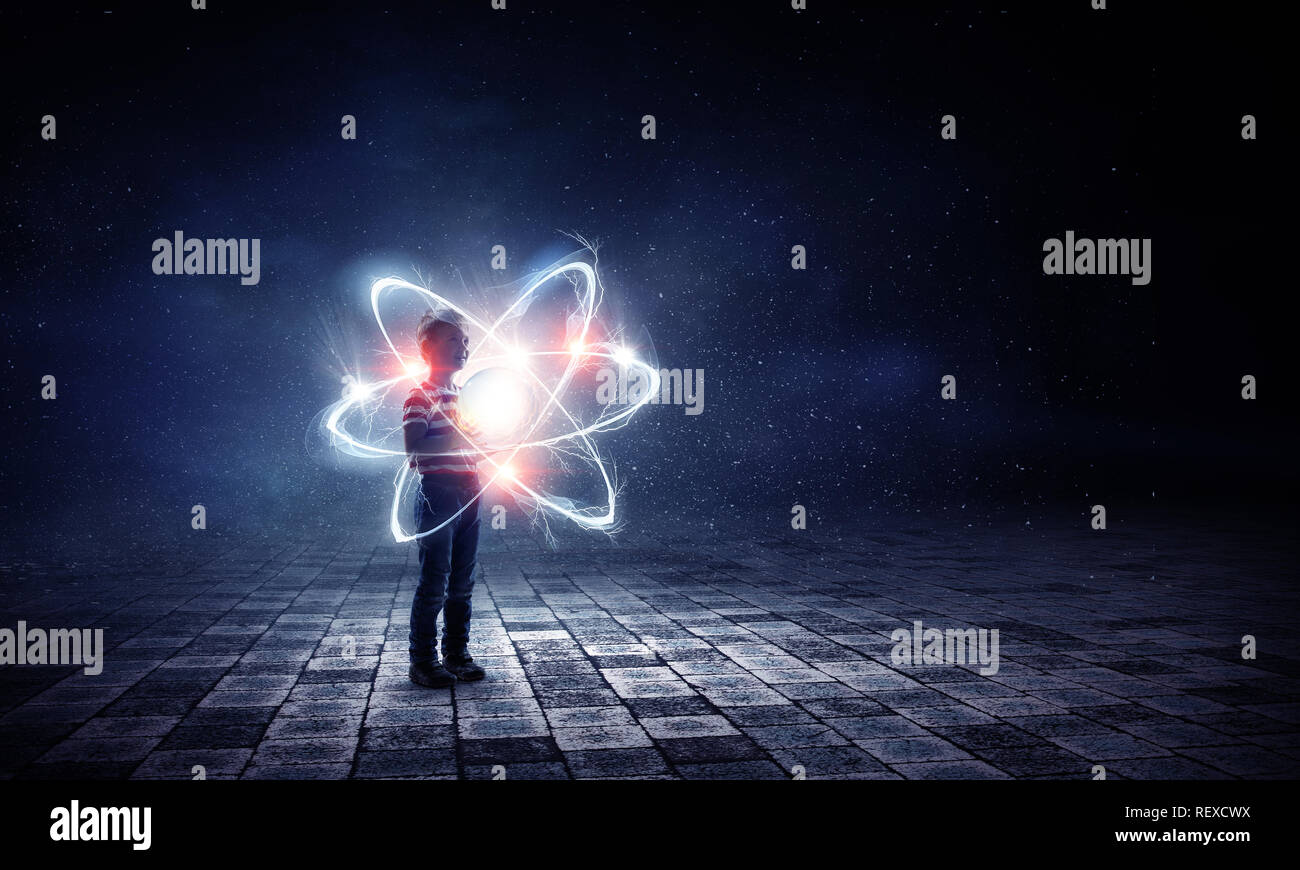 Curious child studying Earth planet in his hands. Elements of this ...